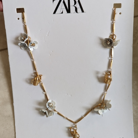 Zara | Jewelry | Zara White And Gold Flower And Watering Can Necklace ...